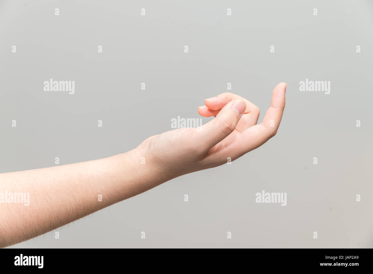 Human hand with curl index finger on light gray background Stock Photo ...