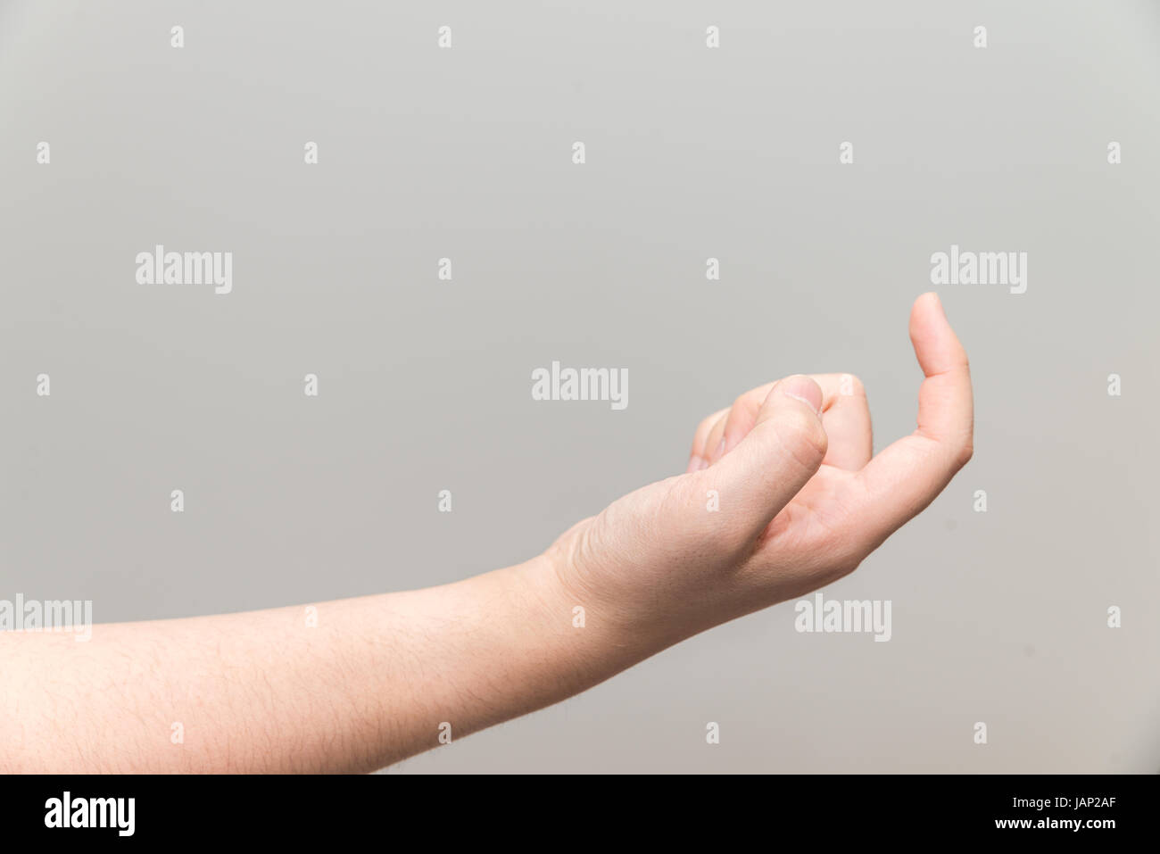 Human hand with curl index finger on light gray background Stock Photo ...