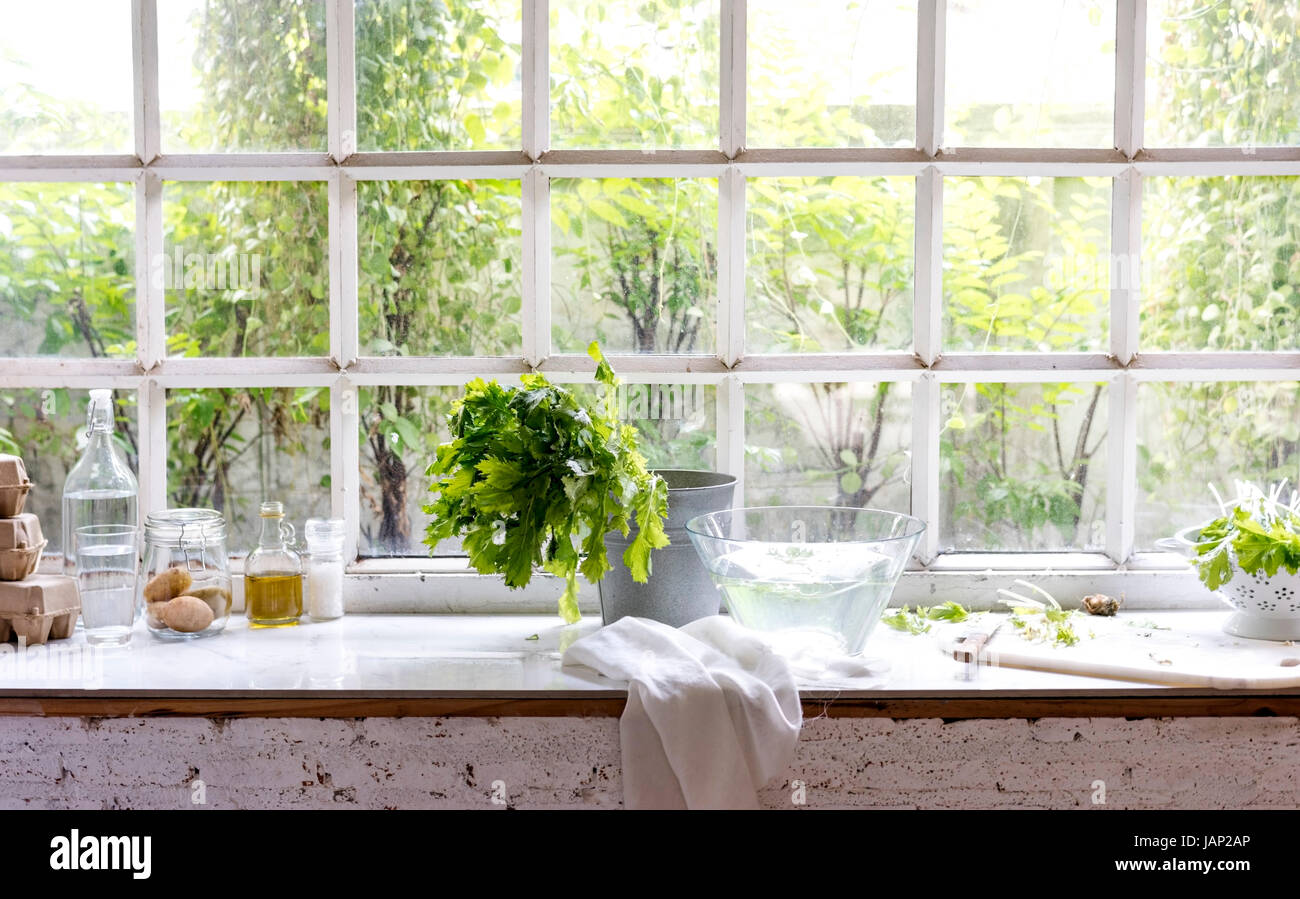 Eggs and washed vegetable by the glass window Stock Photo - Alamy