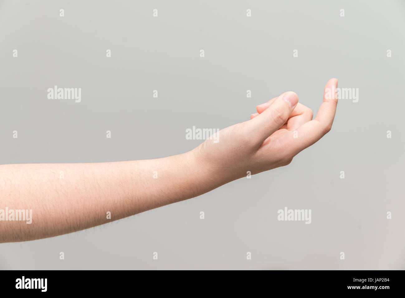 Human hand with curl index finger on light gray background Stock Photo ...