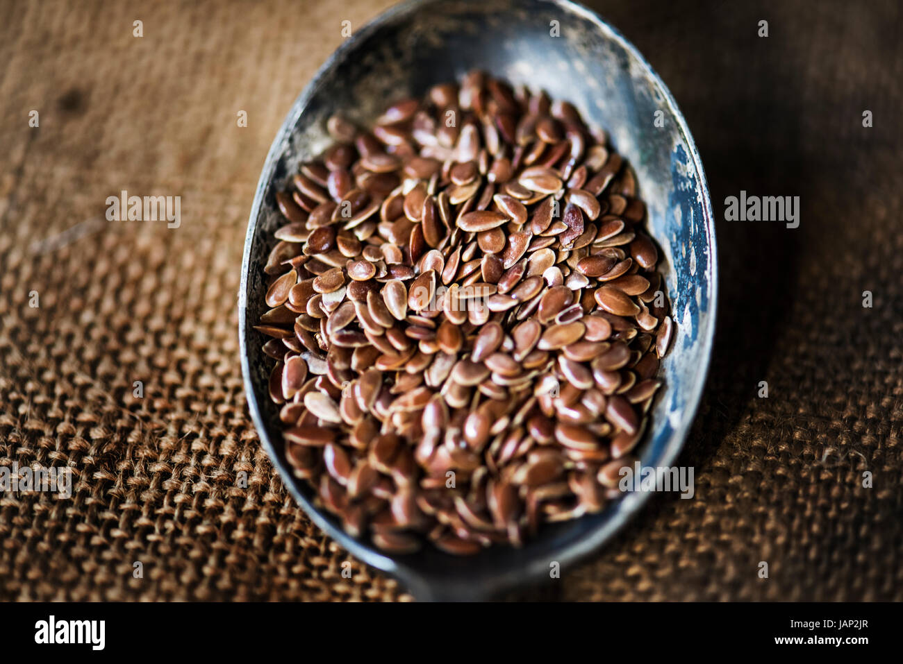Flex seeds in spoon and sackcloth textured Stock Photo - Alamy