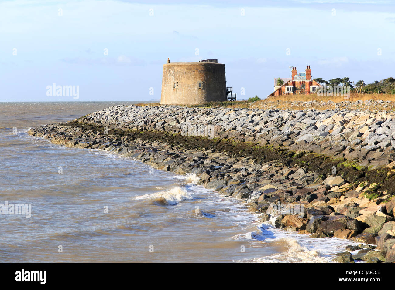 Martello tower W defended by rock armour from coastal erosion, East ...
