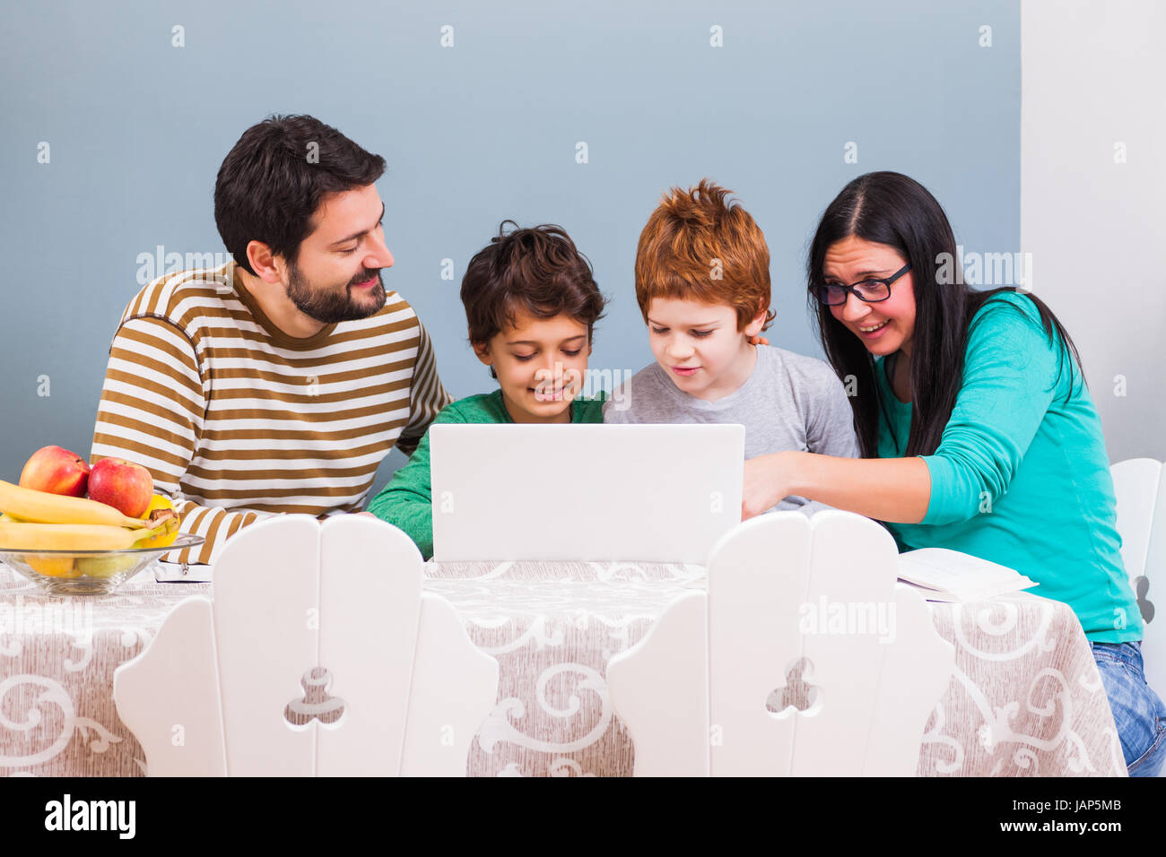 Parents are teaching their children at home Stock Photo - Alamy