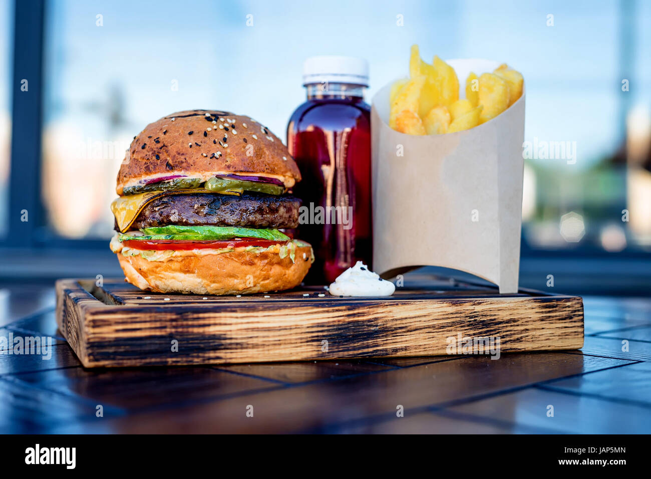 Fastfood set consisting of hamburger, free potato, French fries and ...