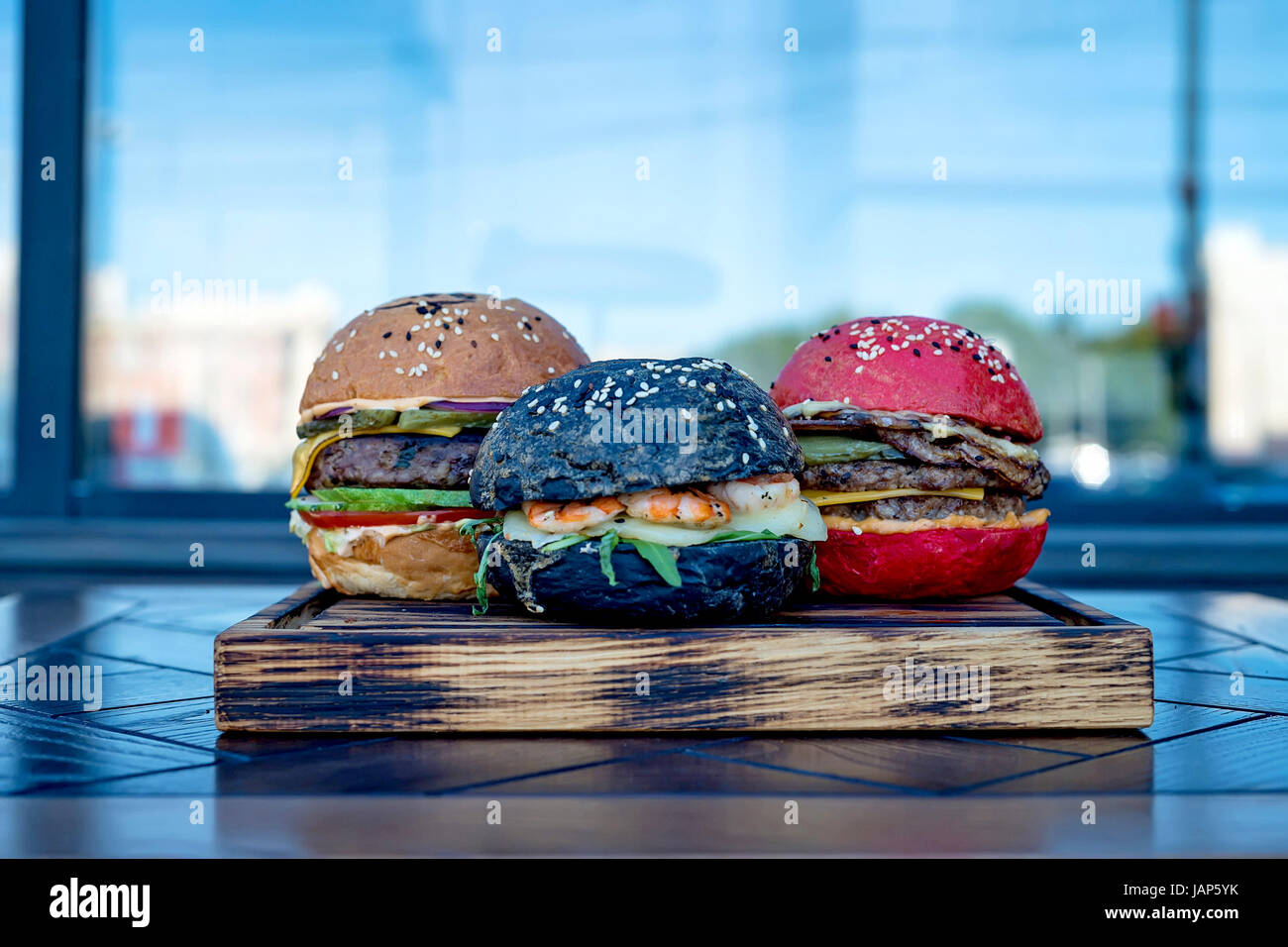 Set of homemade hamburgers with fresh vegetables, color buns and ...