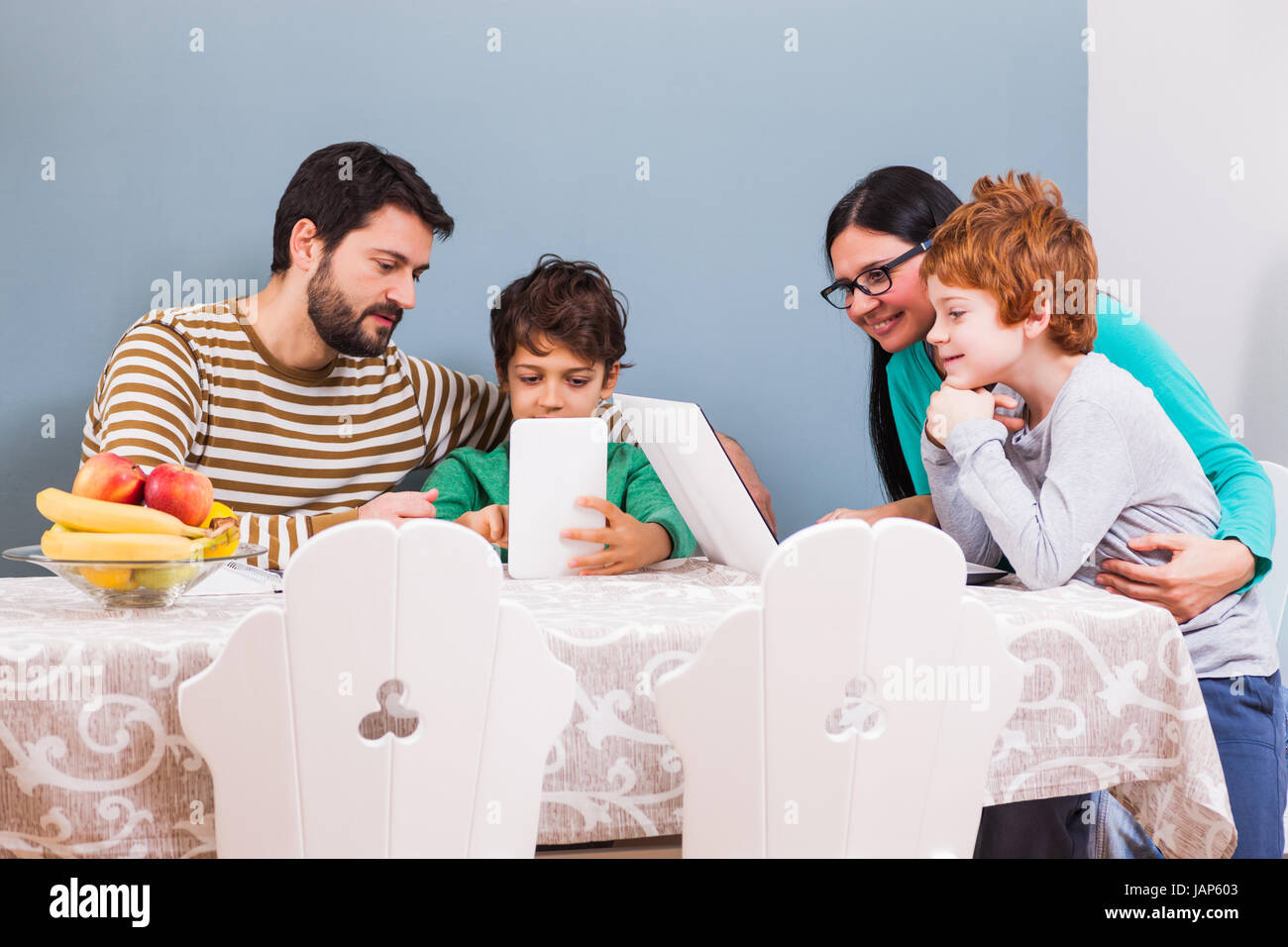 Parents are teaching their children at home Stock Photo - Alamy