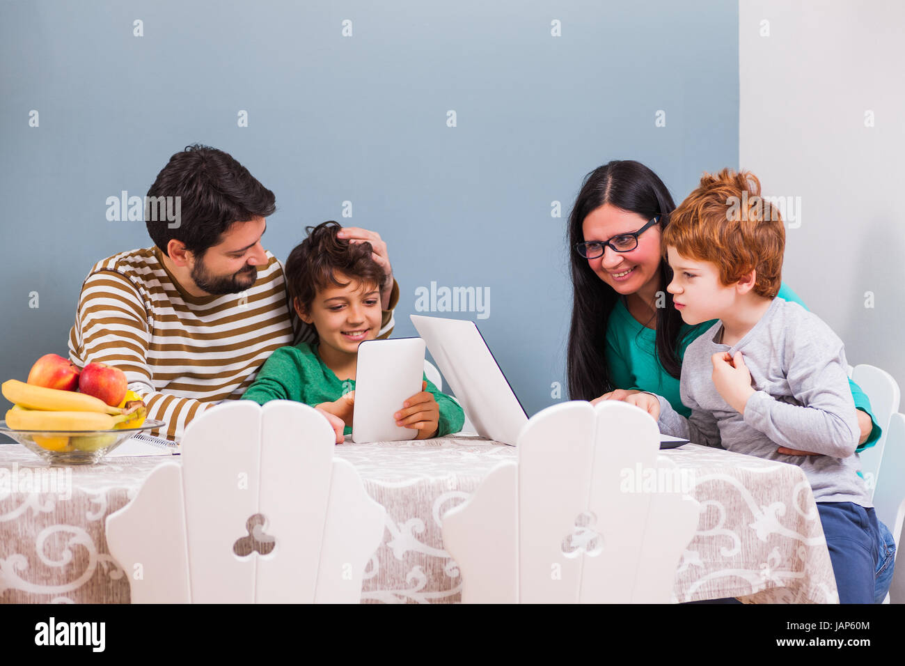 Parents are teaching their children at home Stock Photo - Alamy