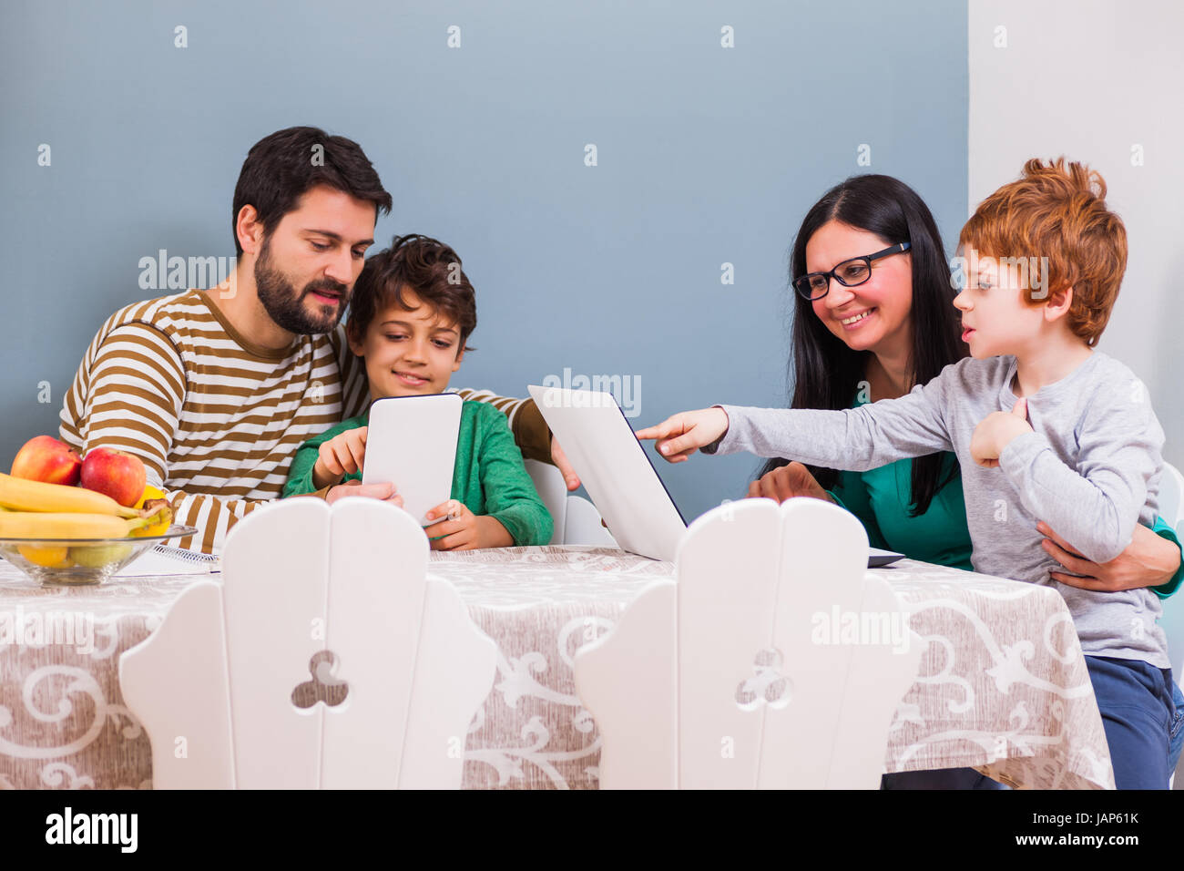 Parents are teaching their children at home Stock Photo - Alamy