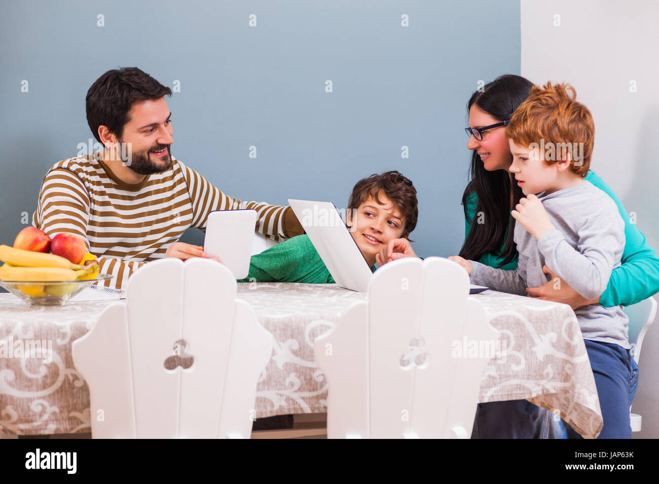 Parents are teaching their children at home Stock Photo - Alamy