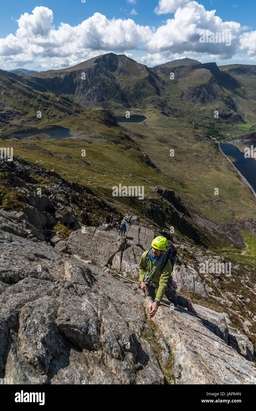People scrambling on Tryfan in Snowdonia Stock Photo - Alamy