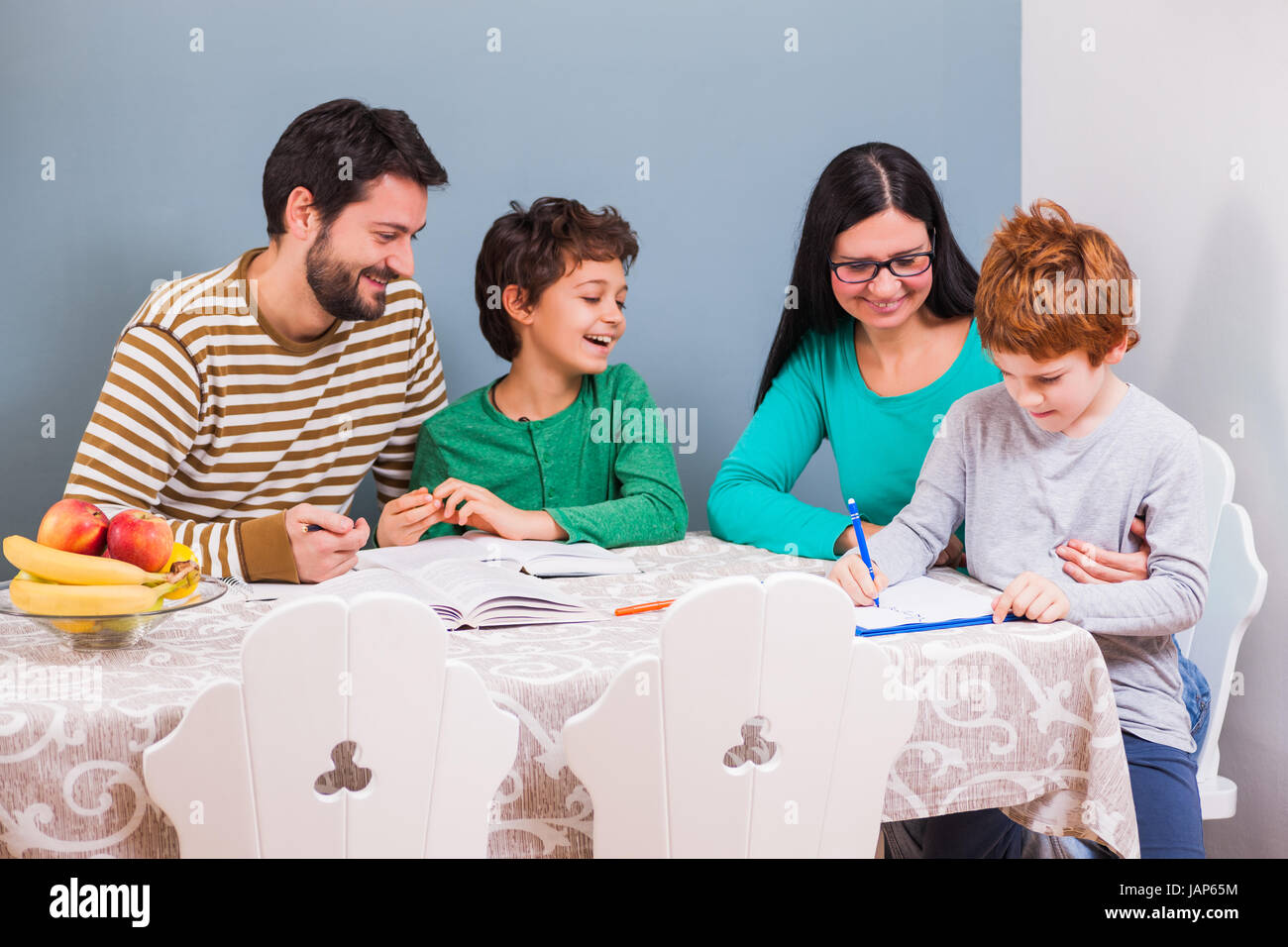 Parents are teaching their children at home Stock Photo - Alamy