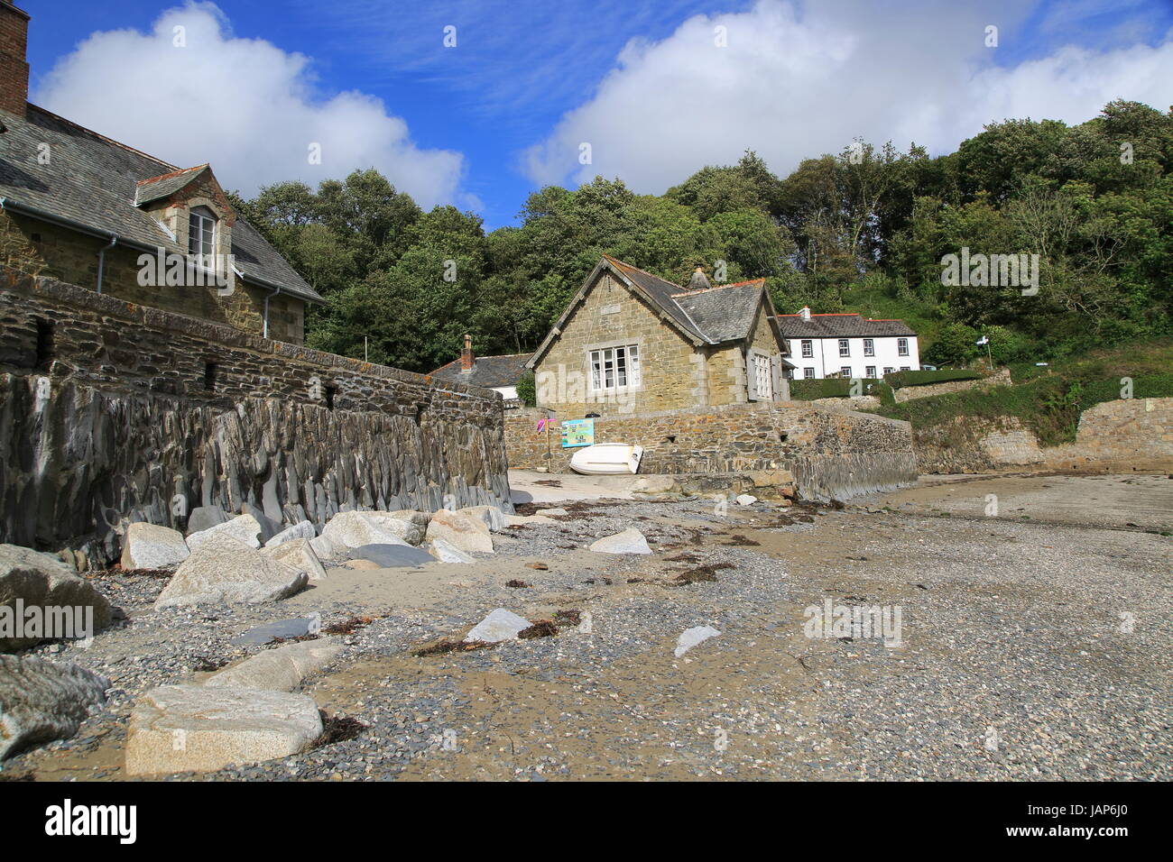 Beach and white cottages at village of durgan hi-res stock photography ...