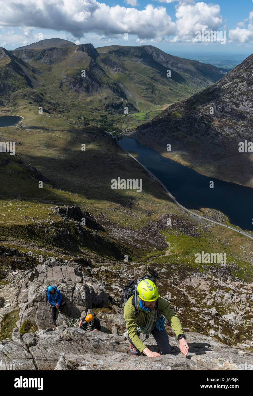 People scrambling on Tryfan in Snowdonia Stock Photo - Alamy