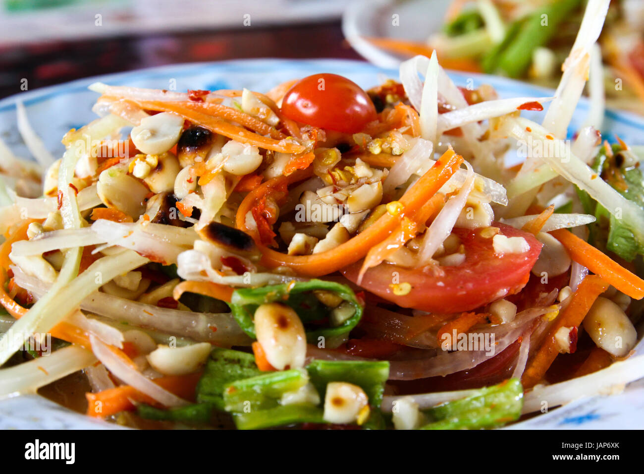 Thai papaya salad also known as Som Tum from Thailand Stock Photo - Alamy