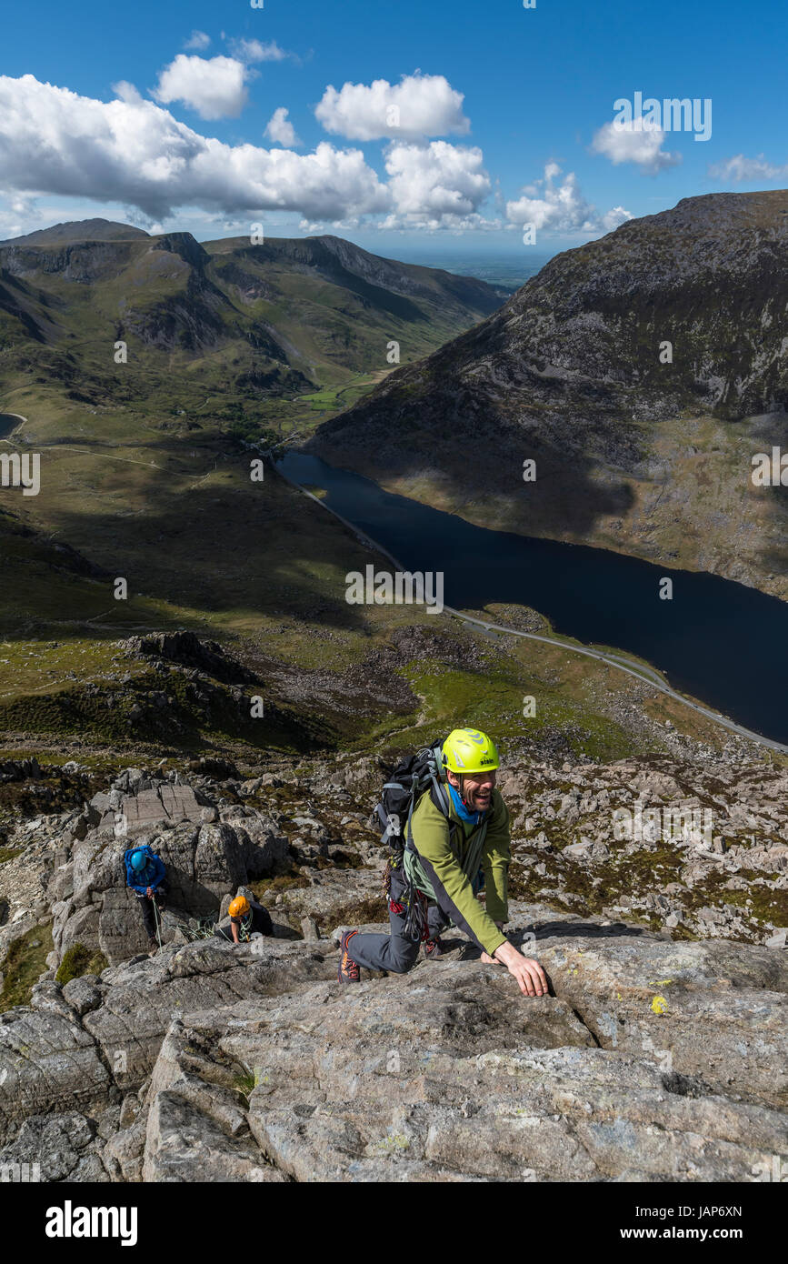 People scrambling on Tryfan in Snowdonia Stock Photo - Alamy
