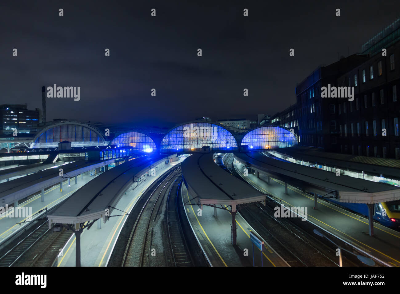 Illuminated train buildings night architecture hi-res stock photography ...