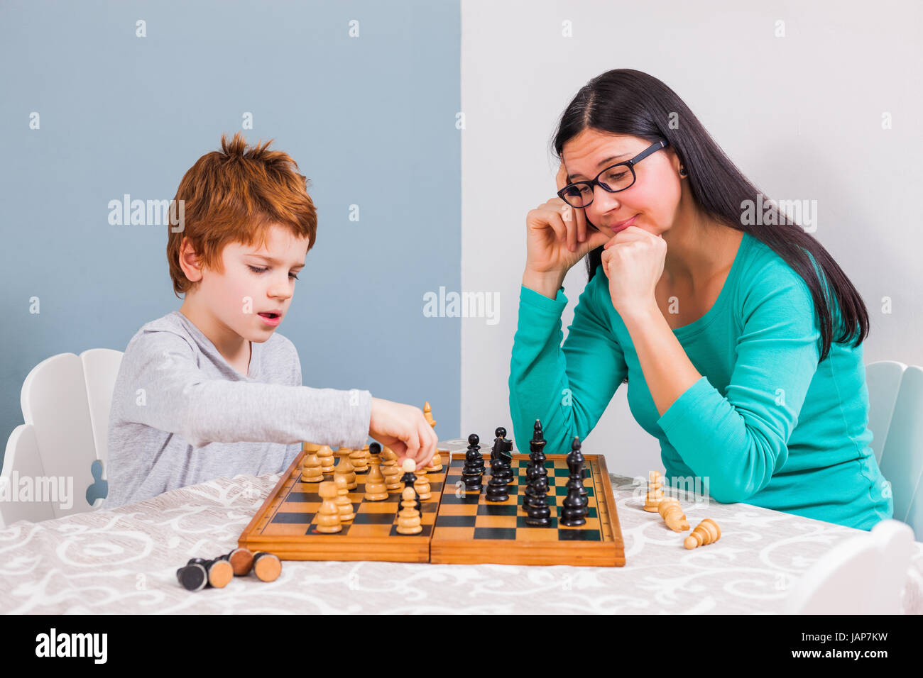 Mother and son playing board game hi-res stock photography and images ...