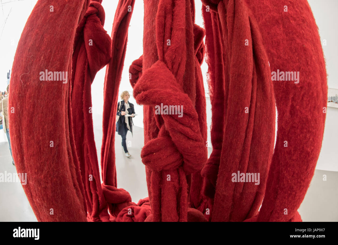 A visitor walks past an installation by artist Cecilia Vicuna from ...