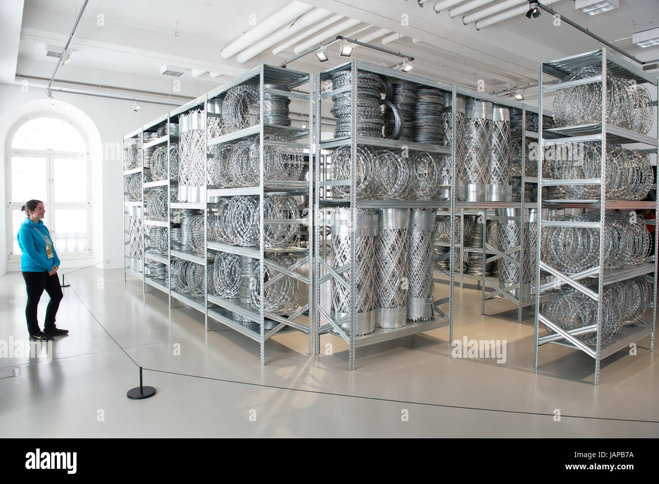 A visitor looks at K. Geers' sculpture 'Acropolis Redux' (2004) on ...