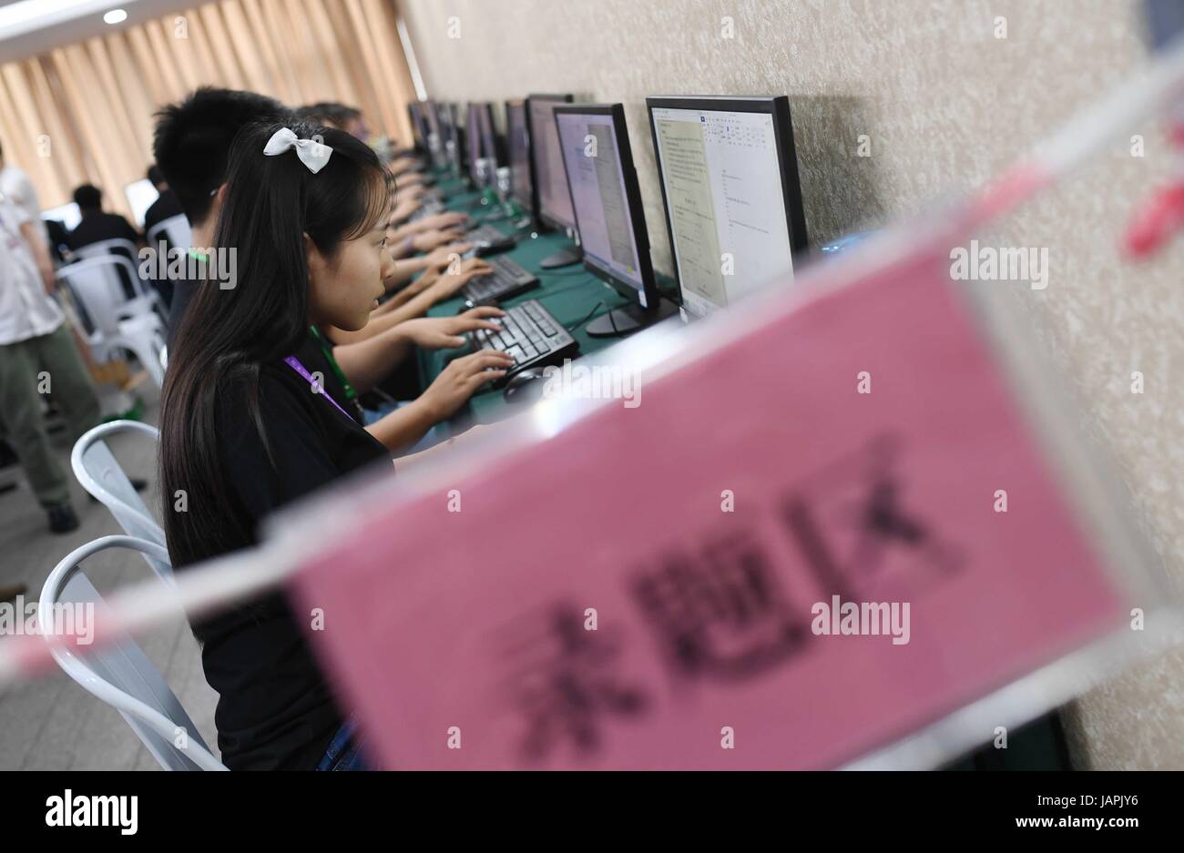 Chengdu, China. 08th June, 2017. Working staff inputs data before a ...