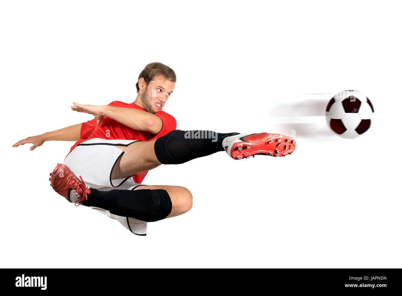Football player kicking a ball isolated in white Stock Photo - Alamy