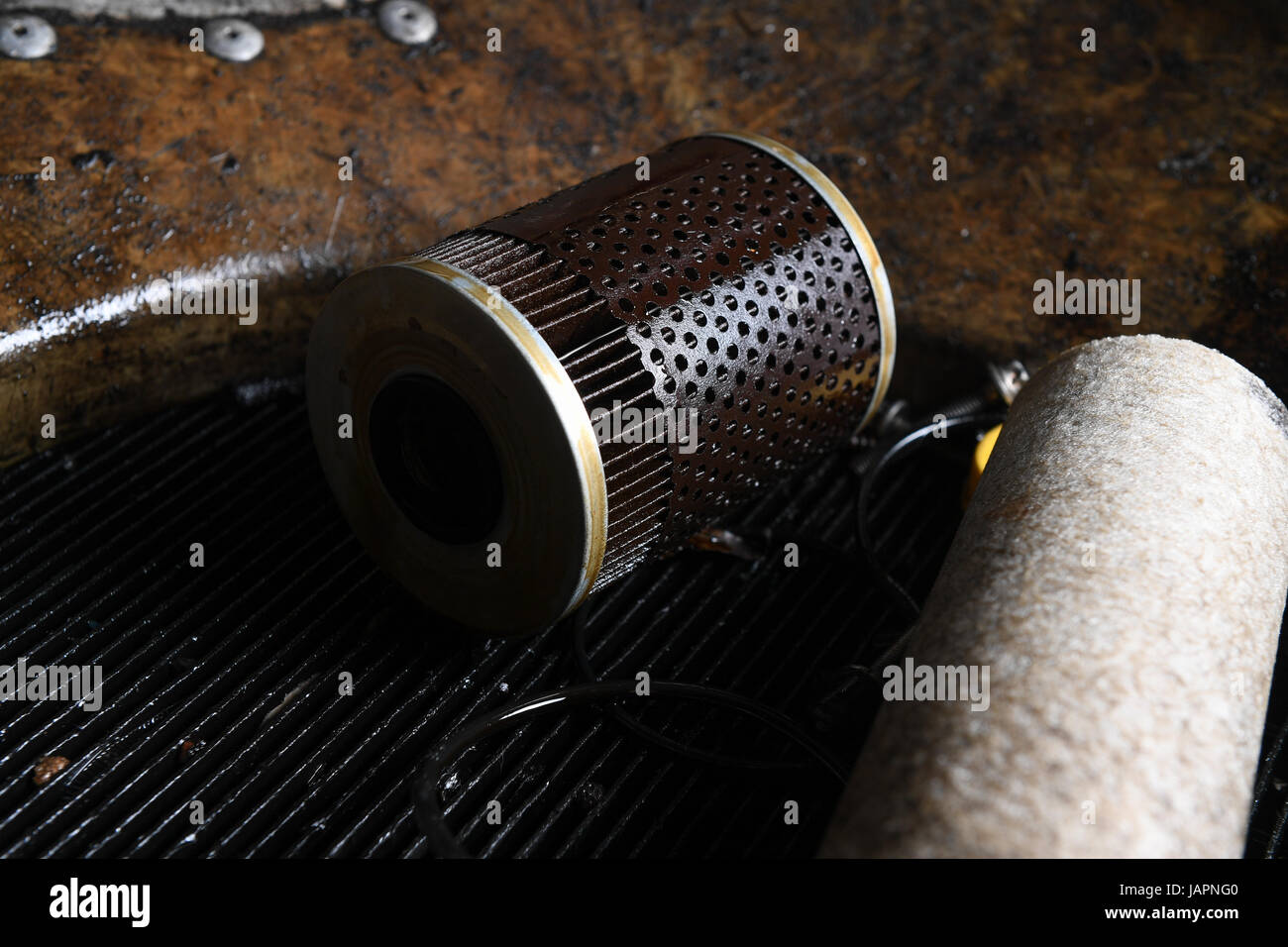 Old Oil Filter during change for service Stock Photo - Alamy