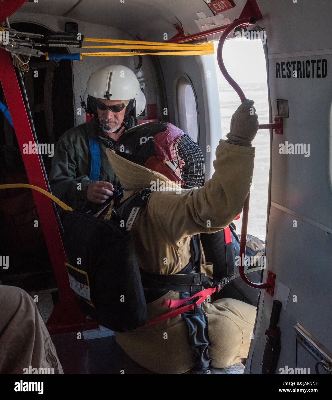 U.S. Department of Interior smokejumper Ariel Starr prepares to jump ...