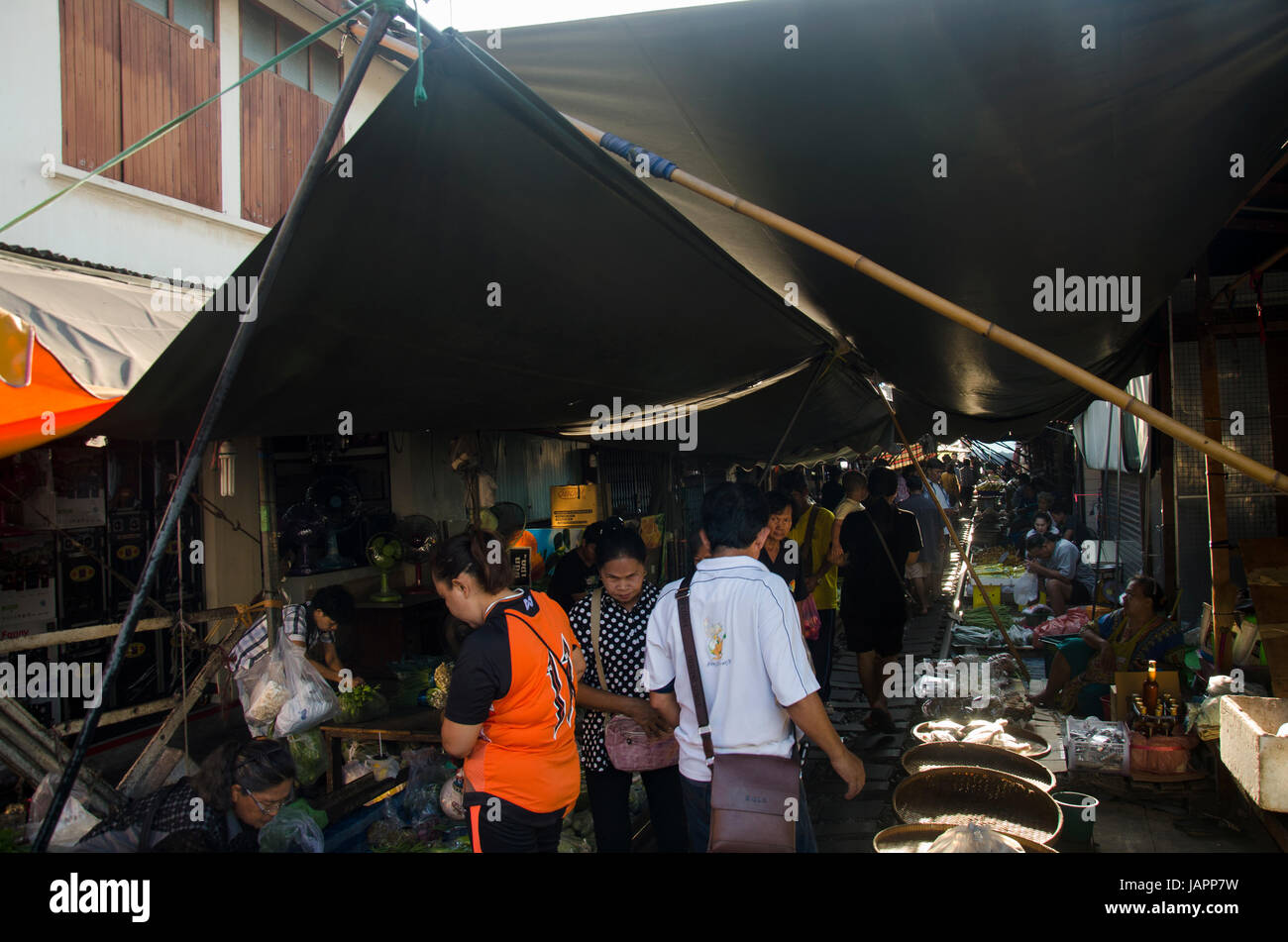 People walking visit and shopping in Mae klong Railway Market or Talat ...