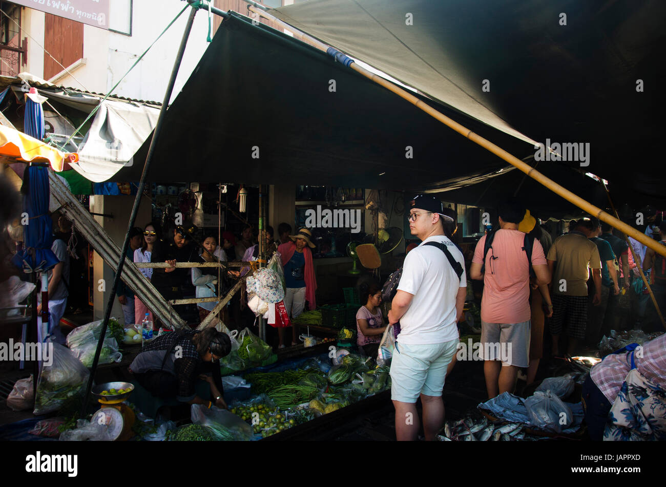 Travelers people visit and looking Mae klong Railway Market or Talat ...