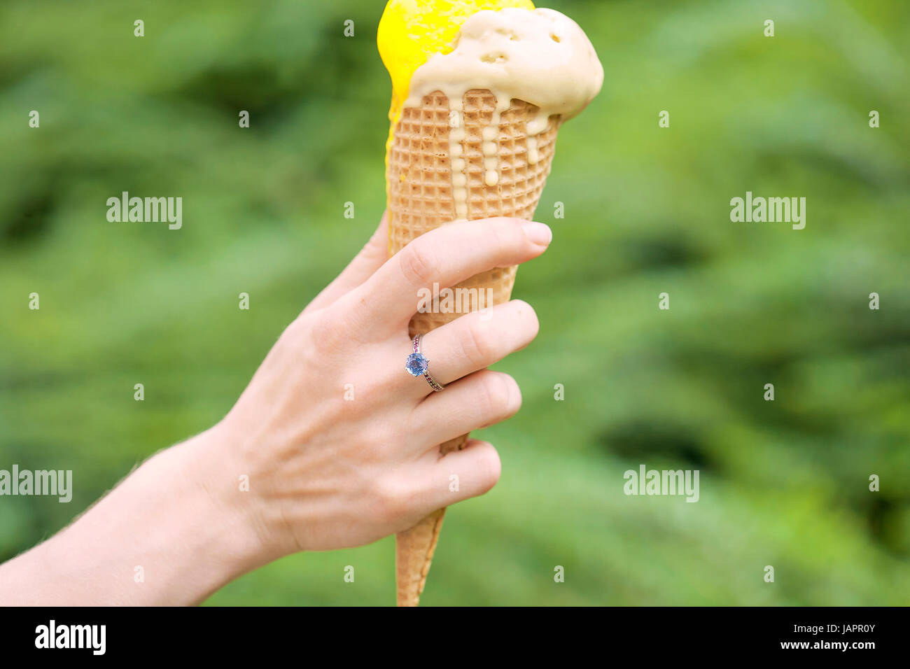 Tasty ice cream in beautiful female hand Stock Photo - Alamy