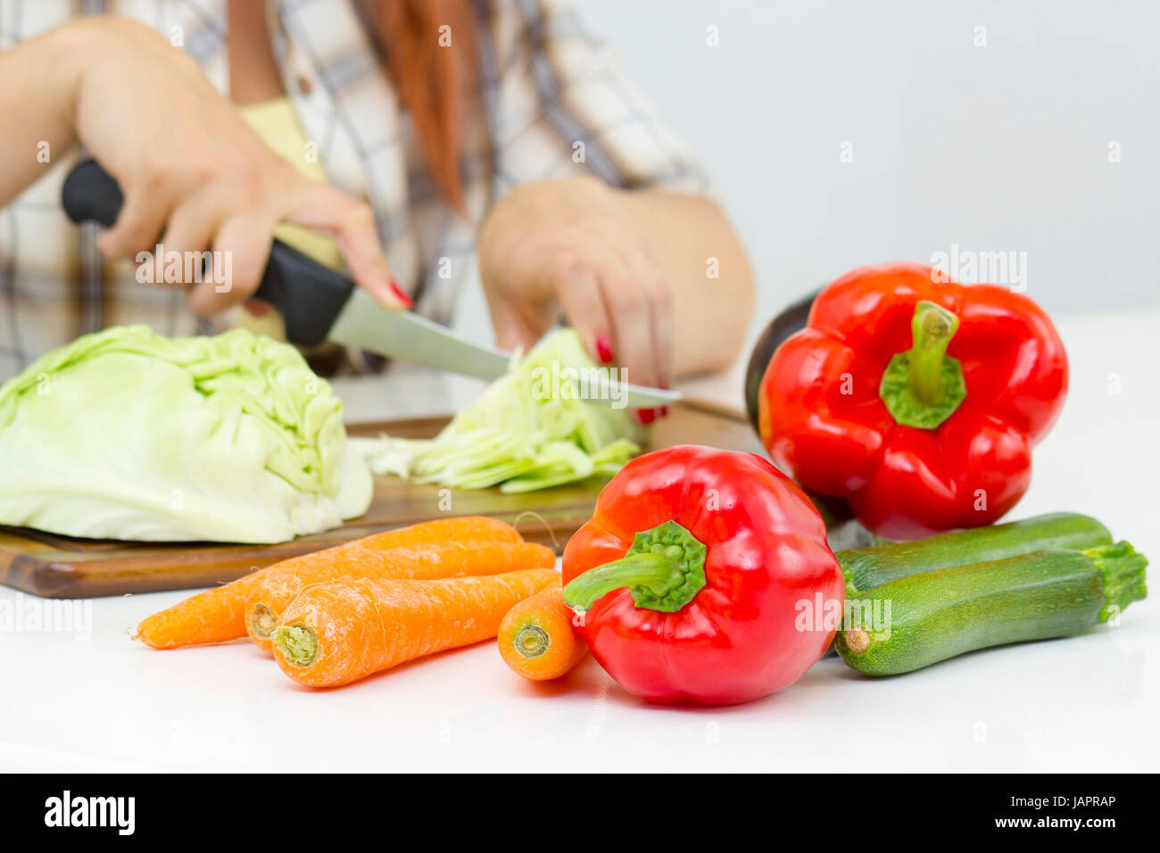 woman cutting vegetables Stock Photo - Alamy