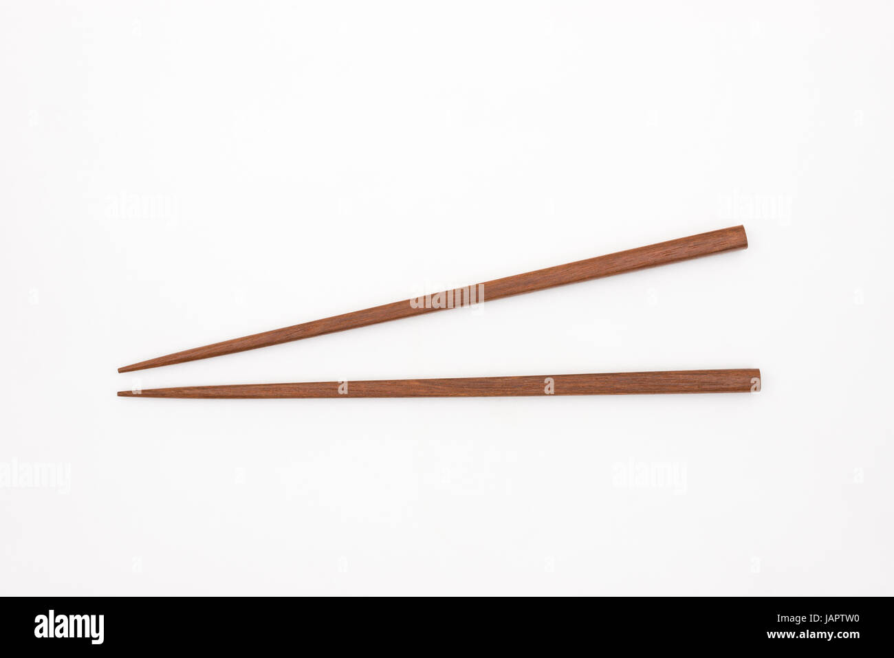 Traditional Japanese wooden chopsticks on white background Stock Photo ...