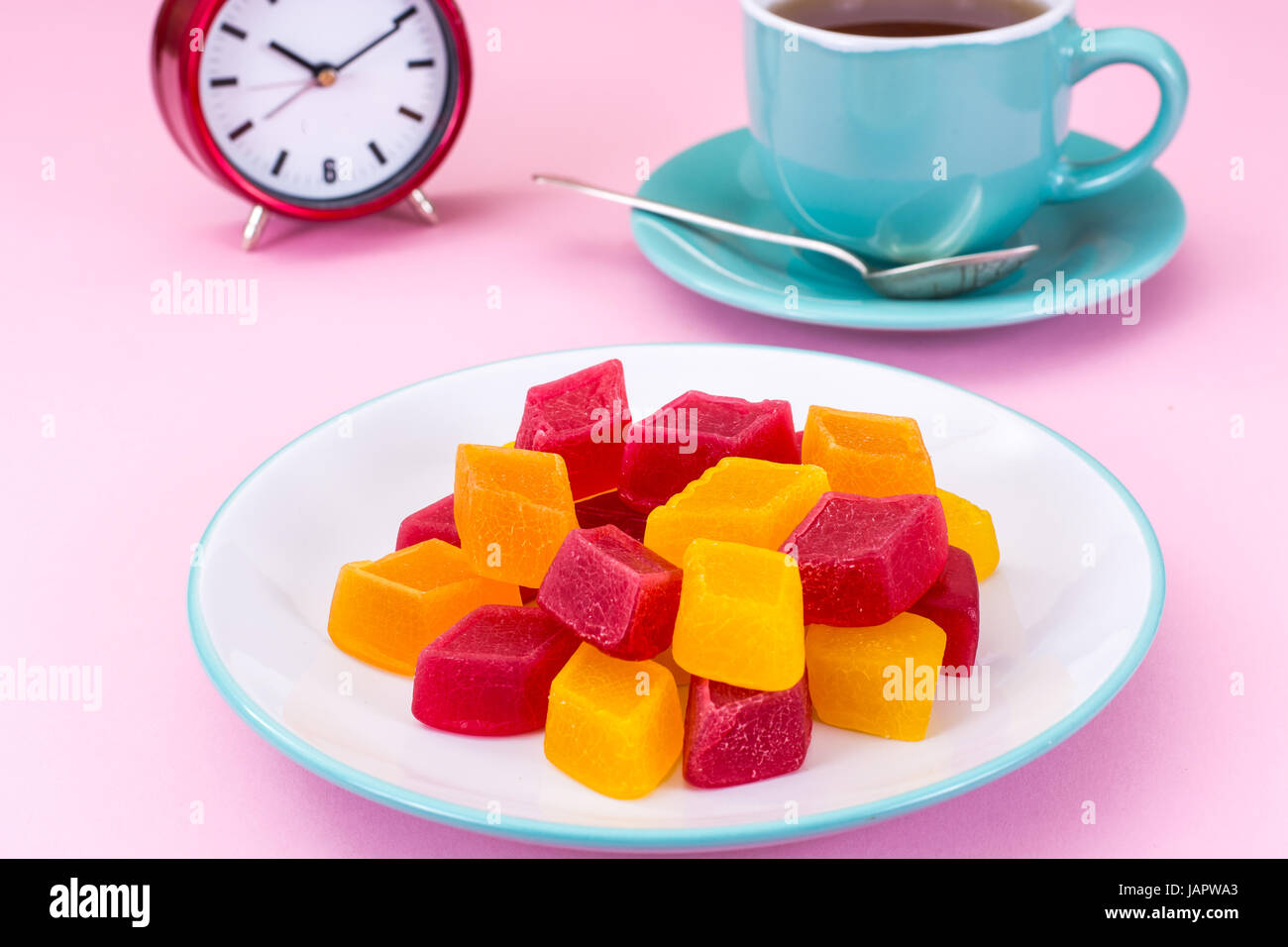Fruit jelly and tea for dessert Stock Photo - Alamy