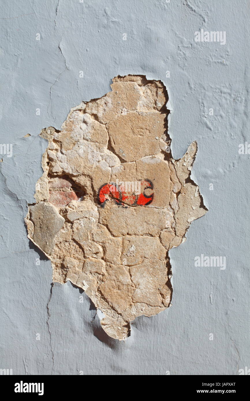 Crumbling plaster by a brick stone wall Stock Photo - Alamy