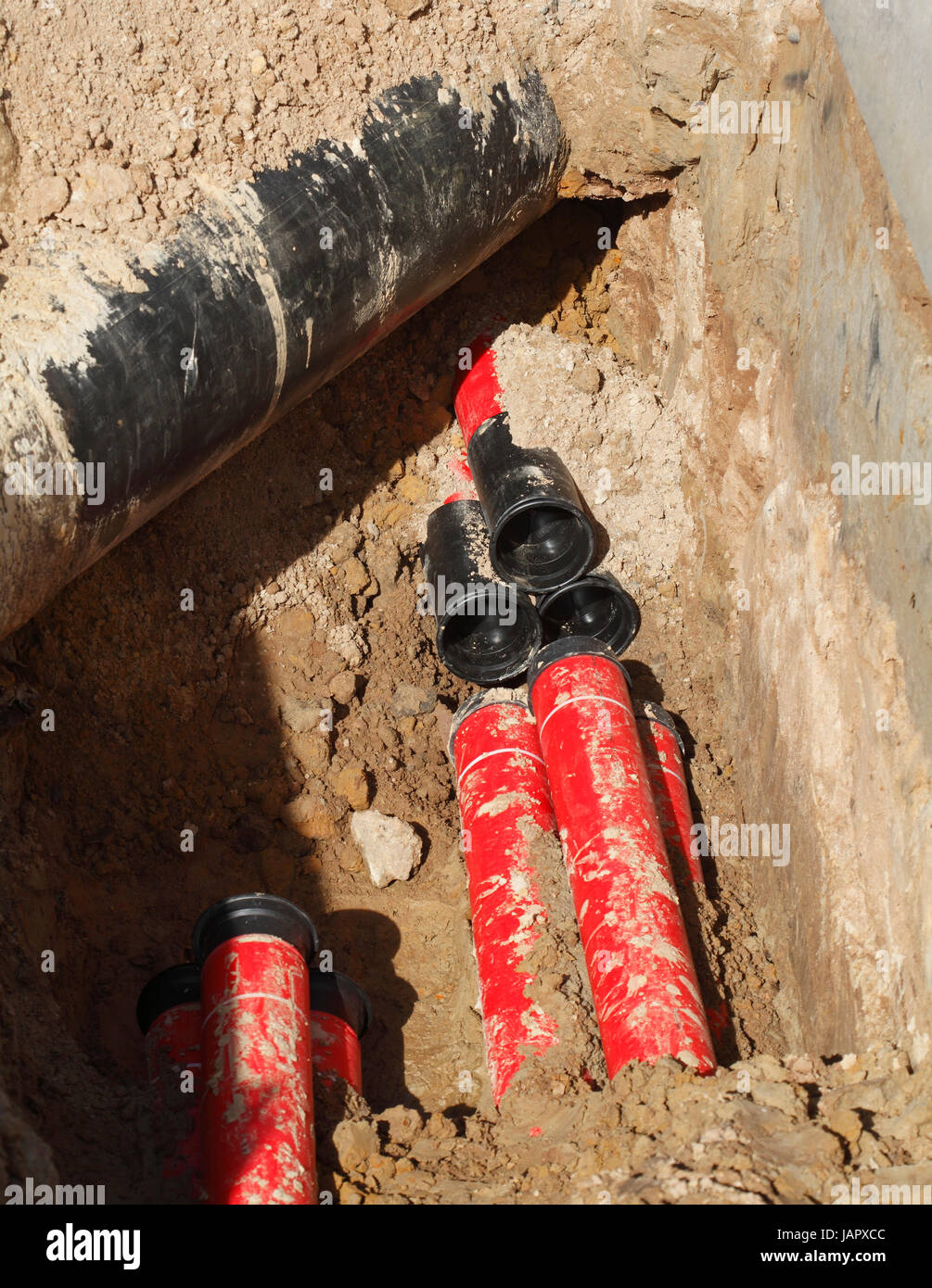 Pipes in the sand on a building site, road construction works Stock ...