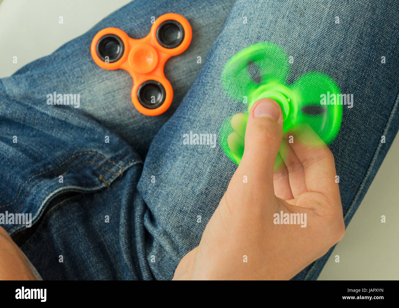 fidget spinner, popular relaxing toy, generic design Stock Photo - Alamy