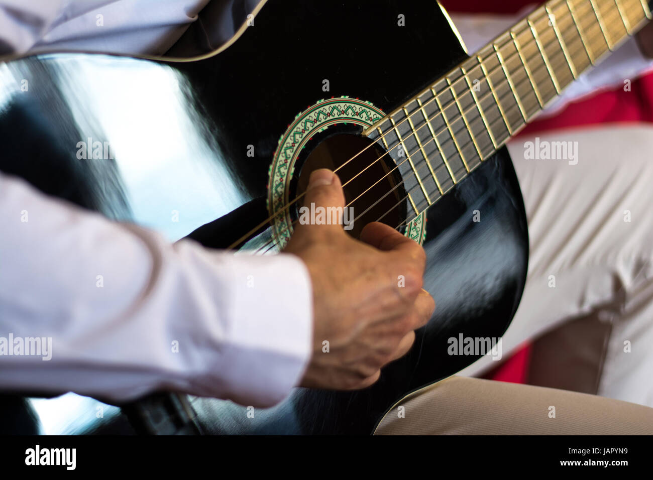 Closeup of a musician playing classical guitar Stock Photo - Alamy