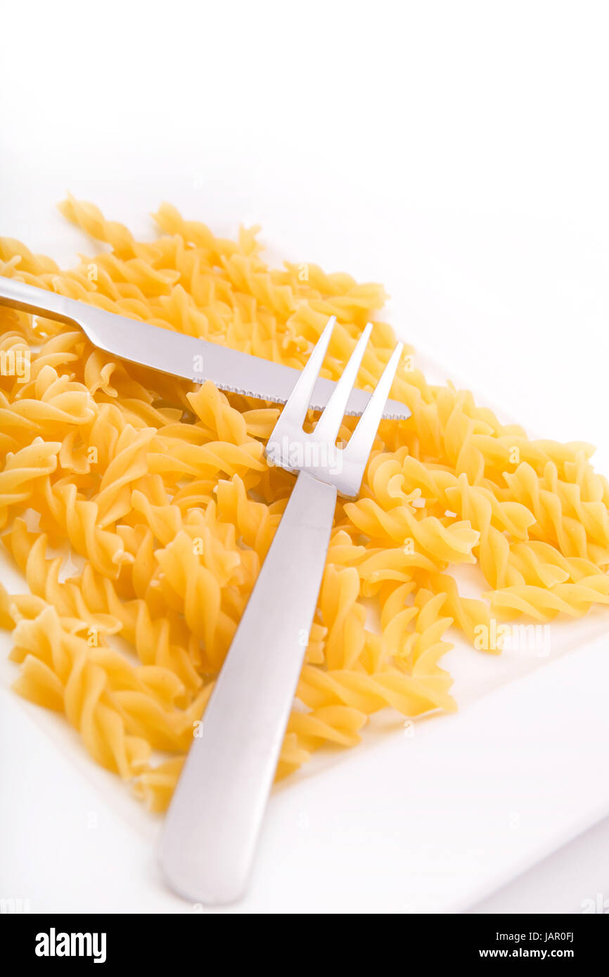 Dry pasta on a white Plate Stock Photo - Alamy