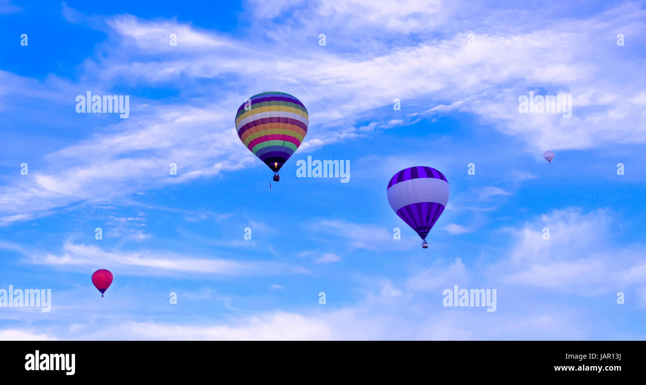 Colorful hot air baloons flying in a summer afternoon Stock Photo - Alamy