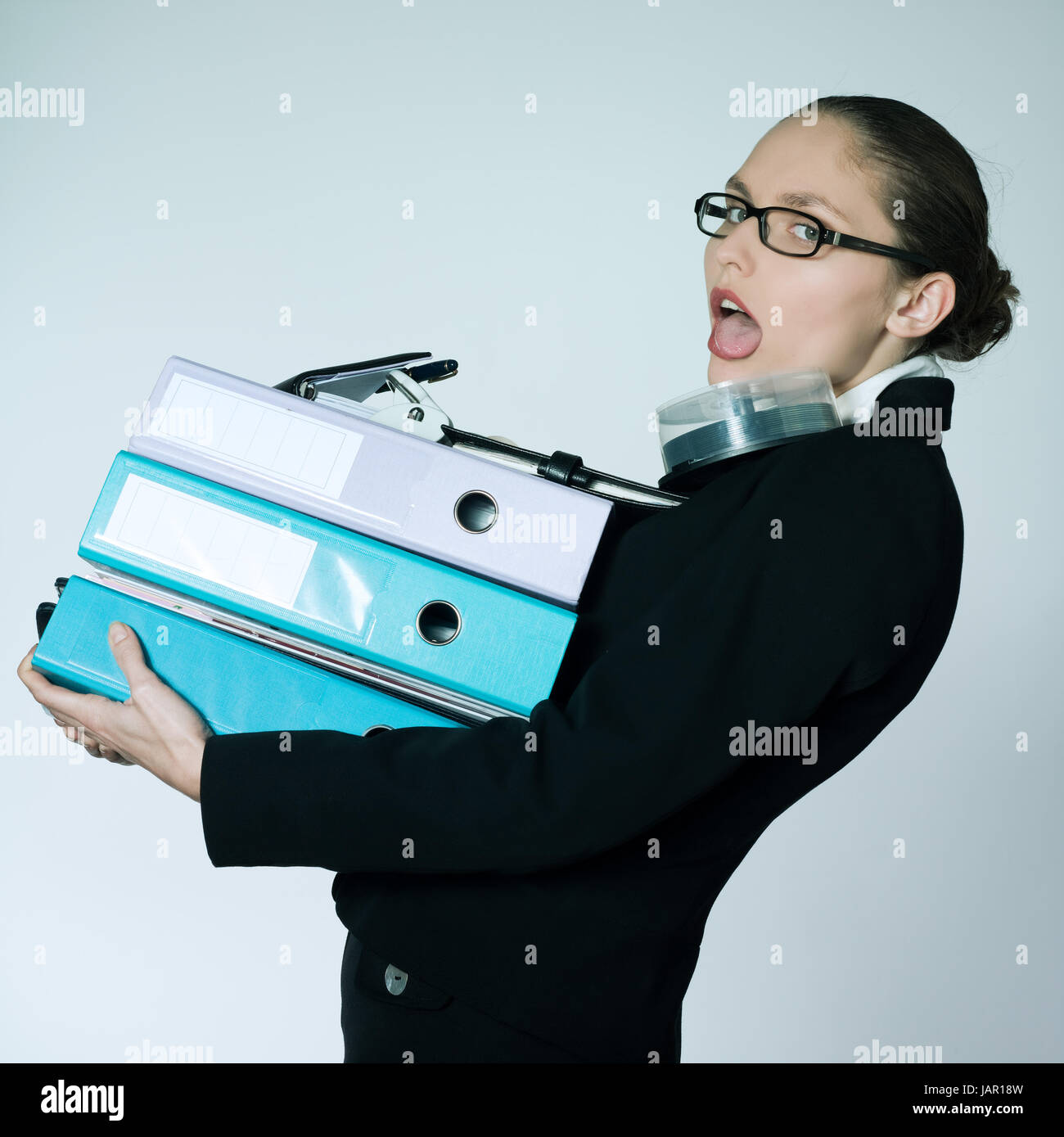studio shot portrait of one caucasian young businesswoman wearing heavy ...
