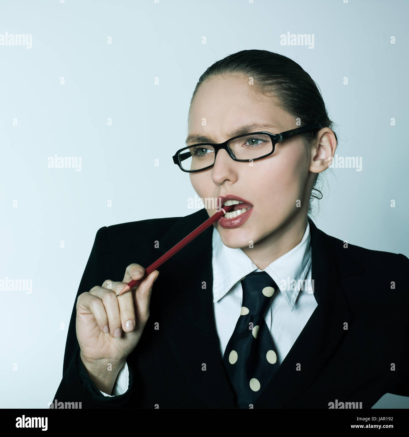 studio shot portrait of one business woman thinking chewing pen Stock ...