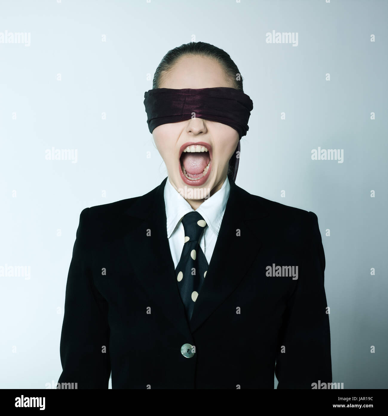 studio shot portrait of one caucasian young blindfold woman Stock Photo ...