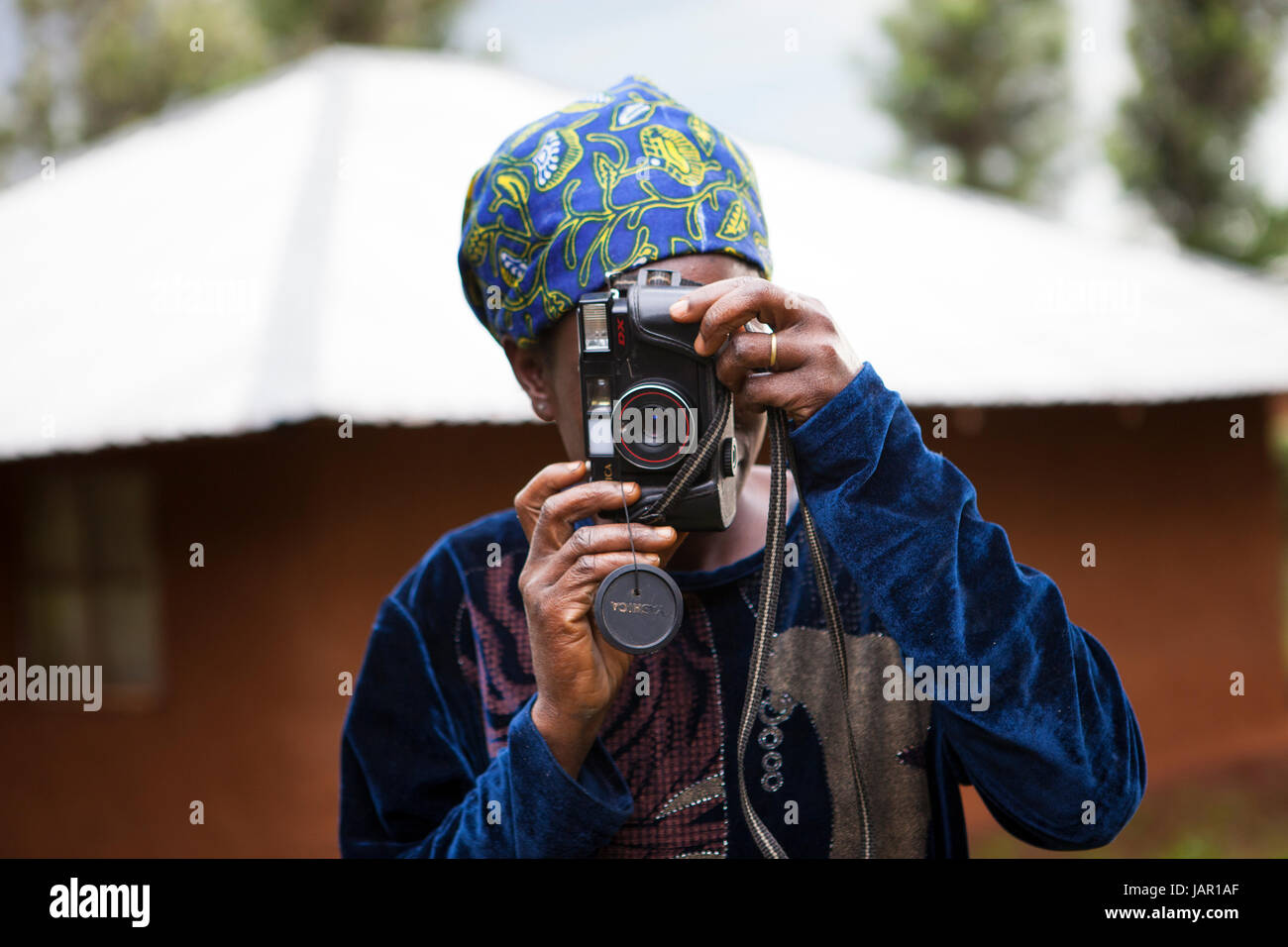 A woman takes a photo of the photographer! Kenya, Africa Stock Photo ...