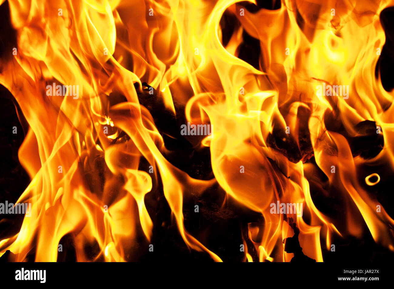 Beautiful yellow and orange hot fire on black background Stock Photo ...