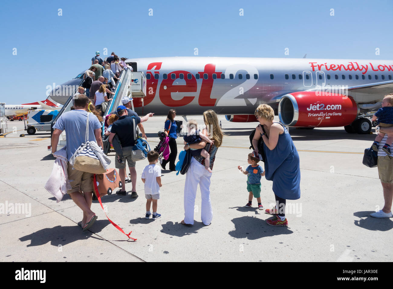 Passengers boarding a jet2.com aircraft at Ibiza airport Stock Photo ...