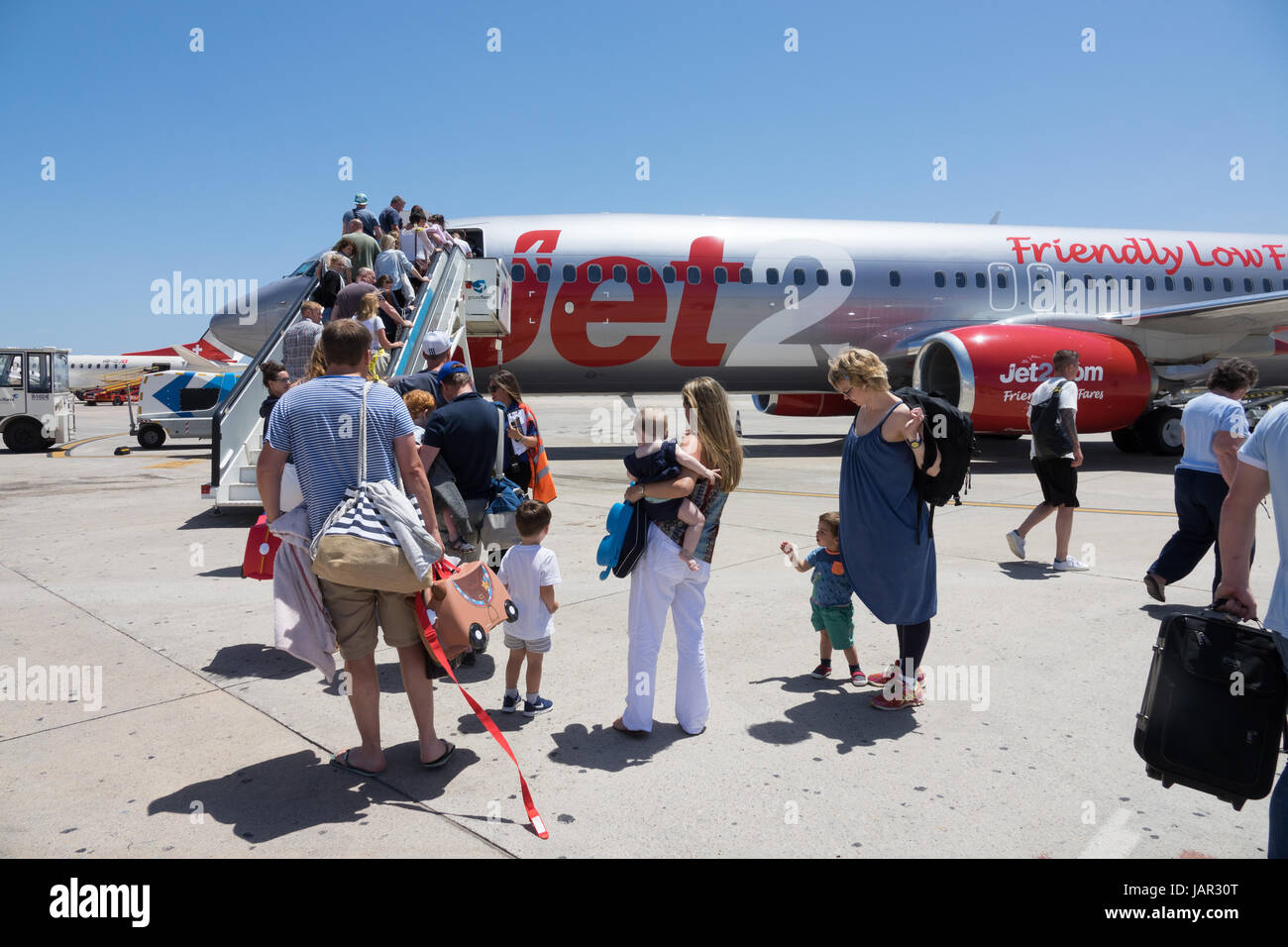 Passengers boarding a jet2.com aircraft at Ibiza airport Stock Photo ...