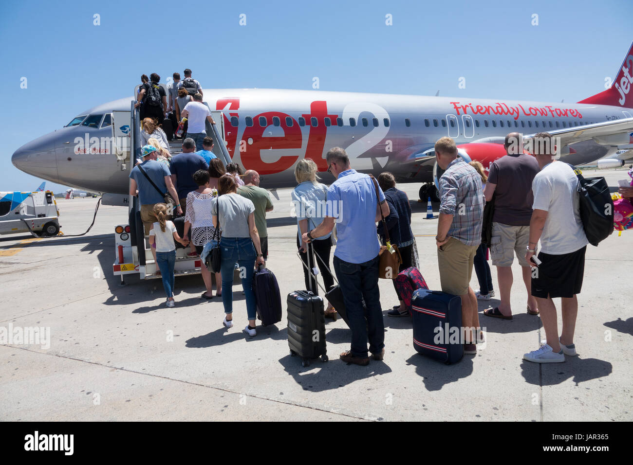 Passengers boarding a jet2.com aircraft at Ibiza airport Stock Photo ...
