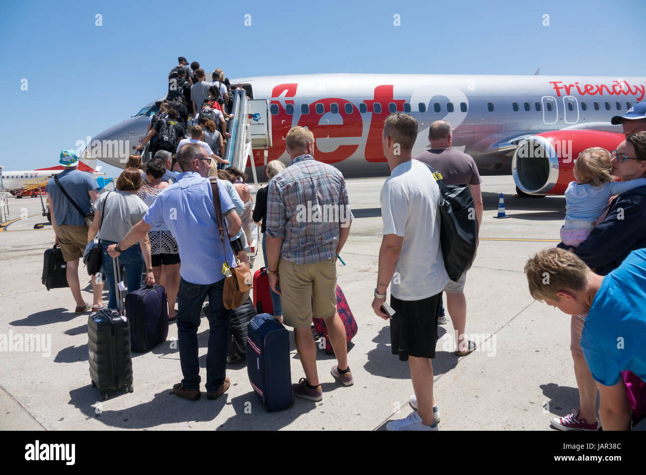 Passengers boarding a jet2.com aircraft at Ibiza airport Stock Photo ...