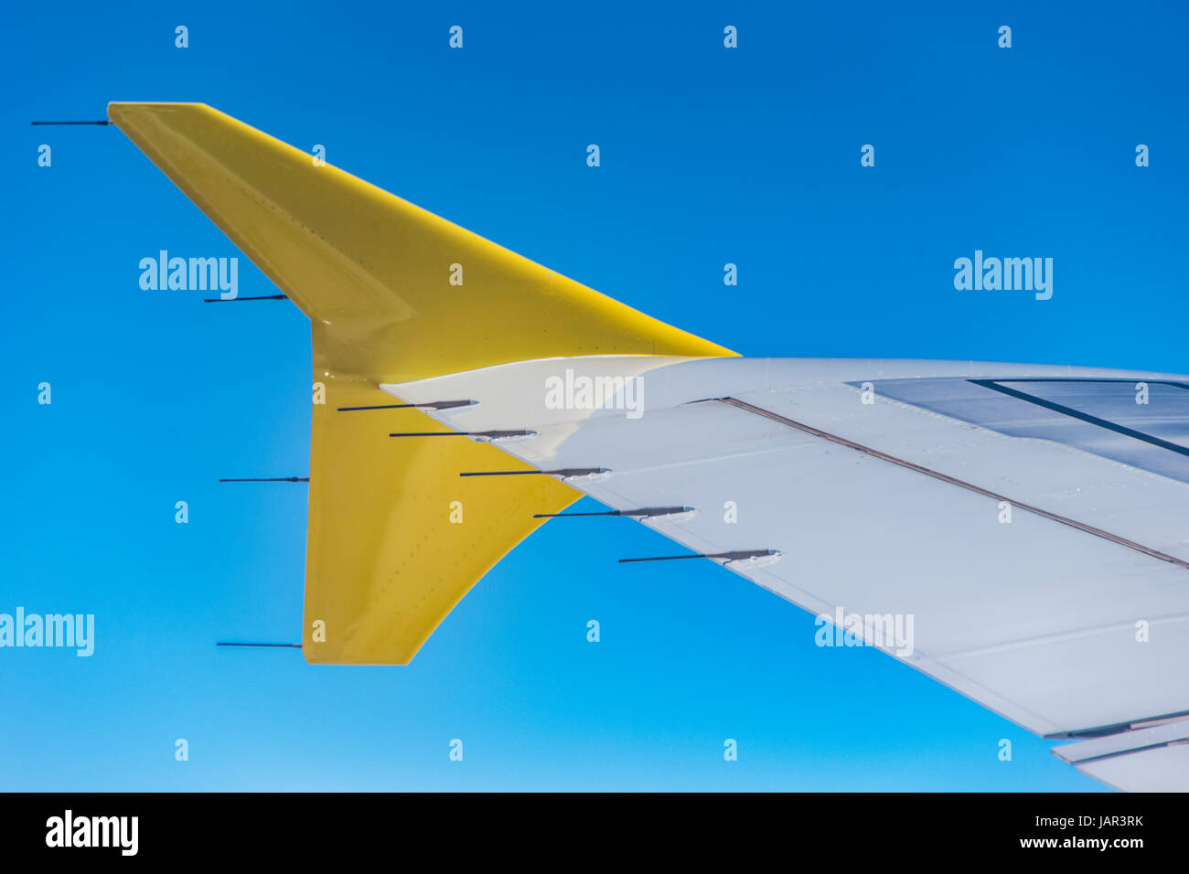 The wing tip of a Vueling jet in flight Stock Photo - Alamy