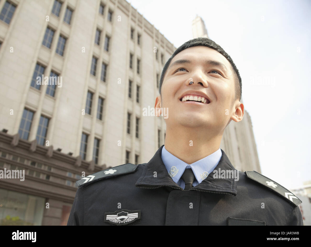 Police officer smiling low angle hi-res stock photography and images ...